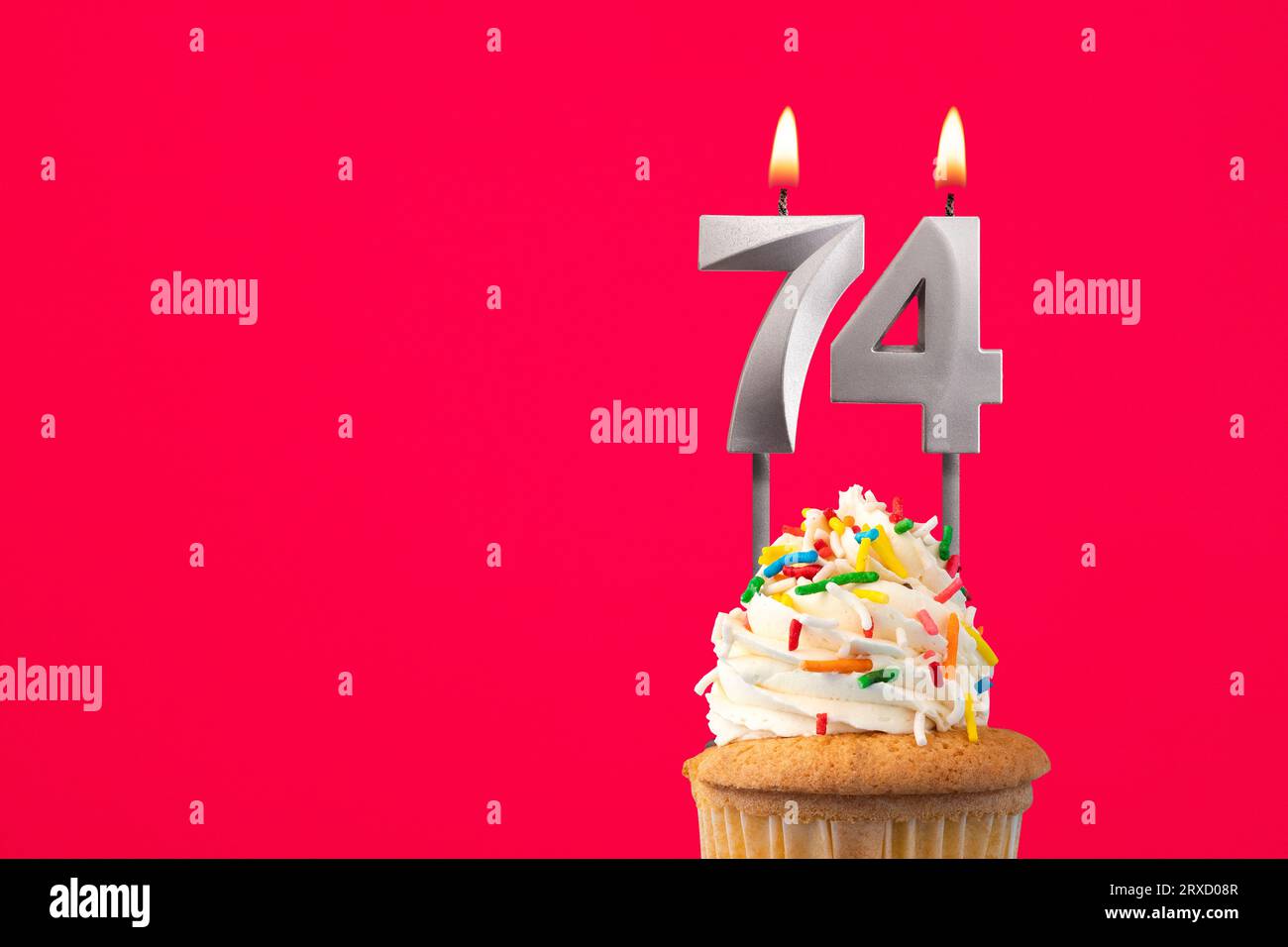 Burning candle number 74 - Birthday card with cake Stock Photo - Alamy