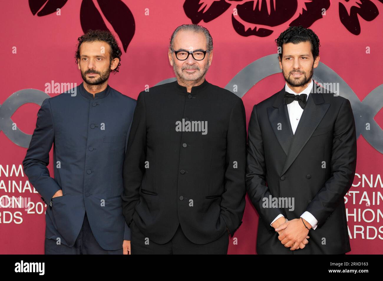 Remo Ruffini, centre, poses for photographers with his sons Pietro ...