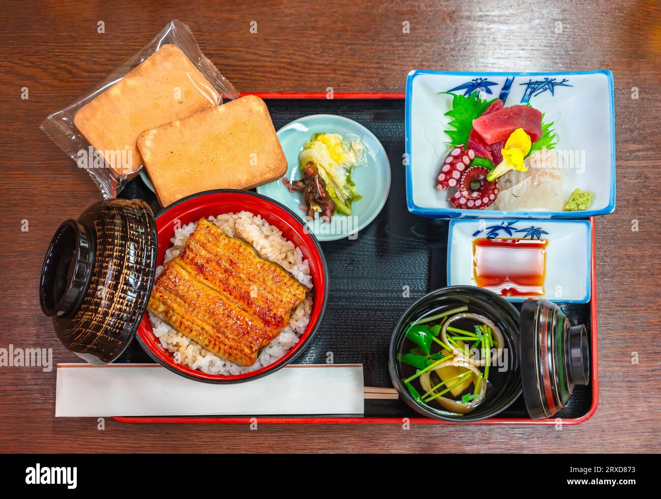 Japanese meal set with a bowl of unagi eel fillets grilled in a ...