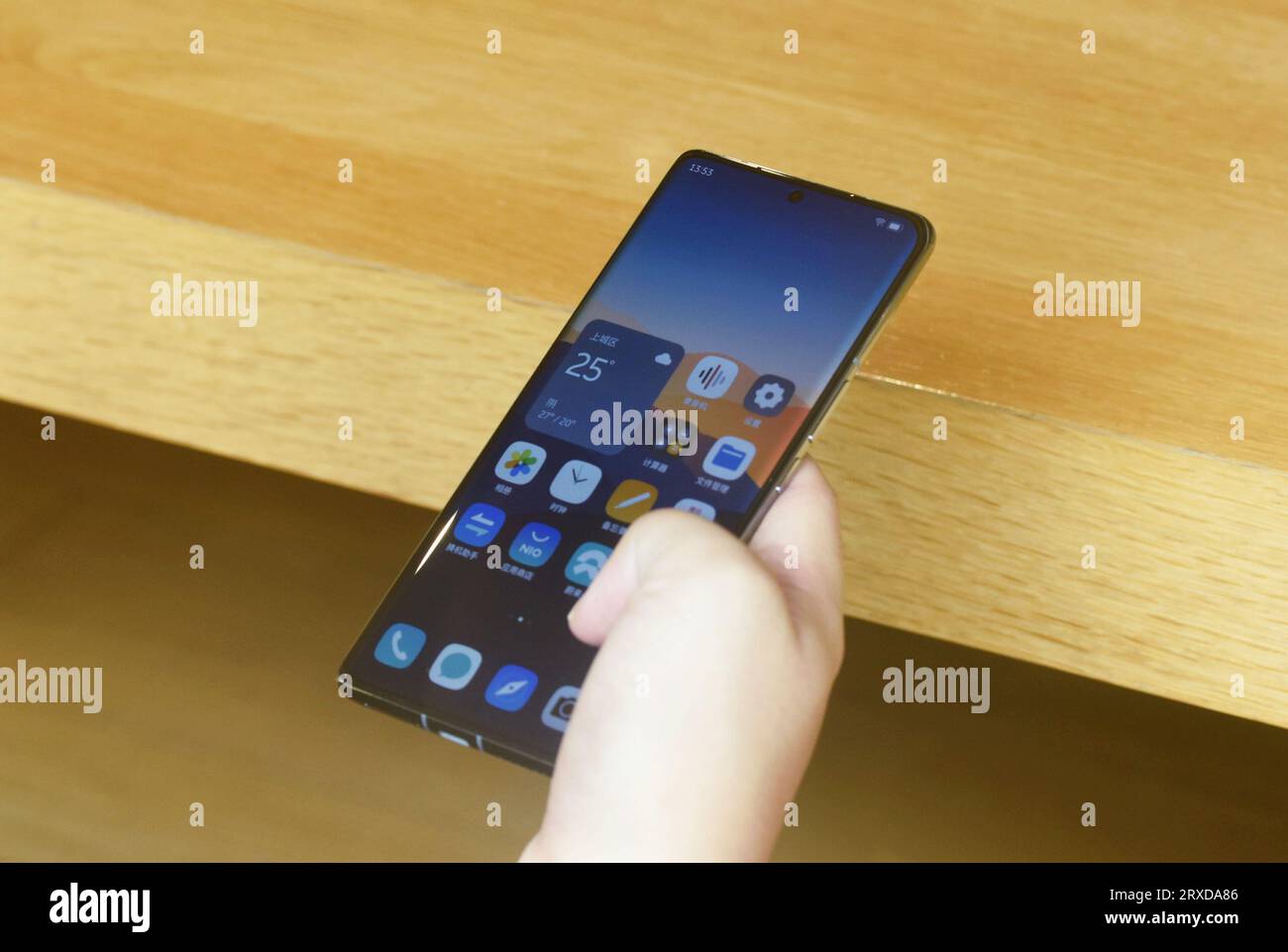 HANGZHOU, CHINA - SEPTEMBER 24, 2023 - A customer experiences NIO Phone ...