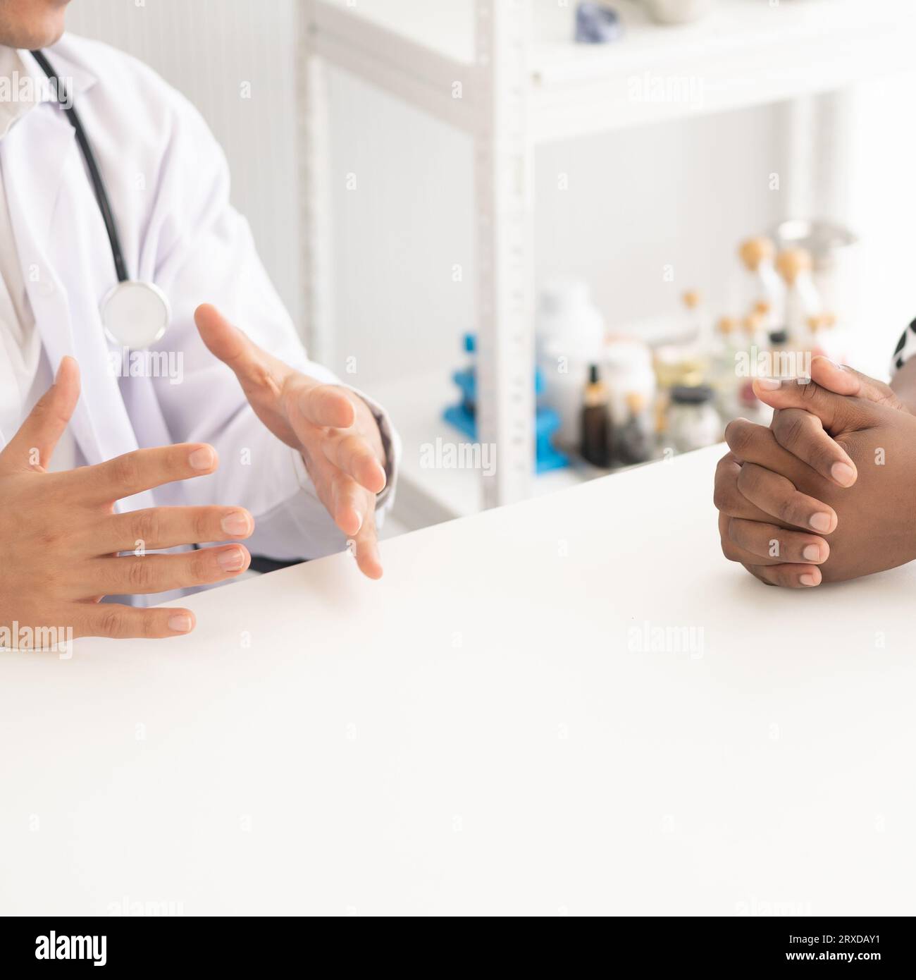Hispanic physician check-up African American patient with stethoscope ...