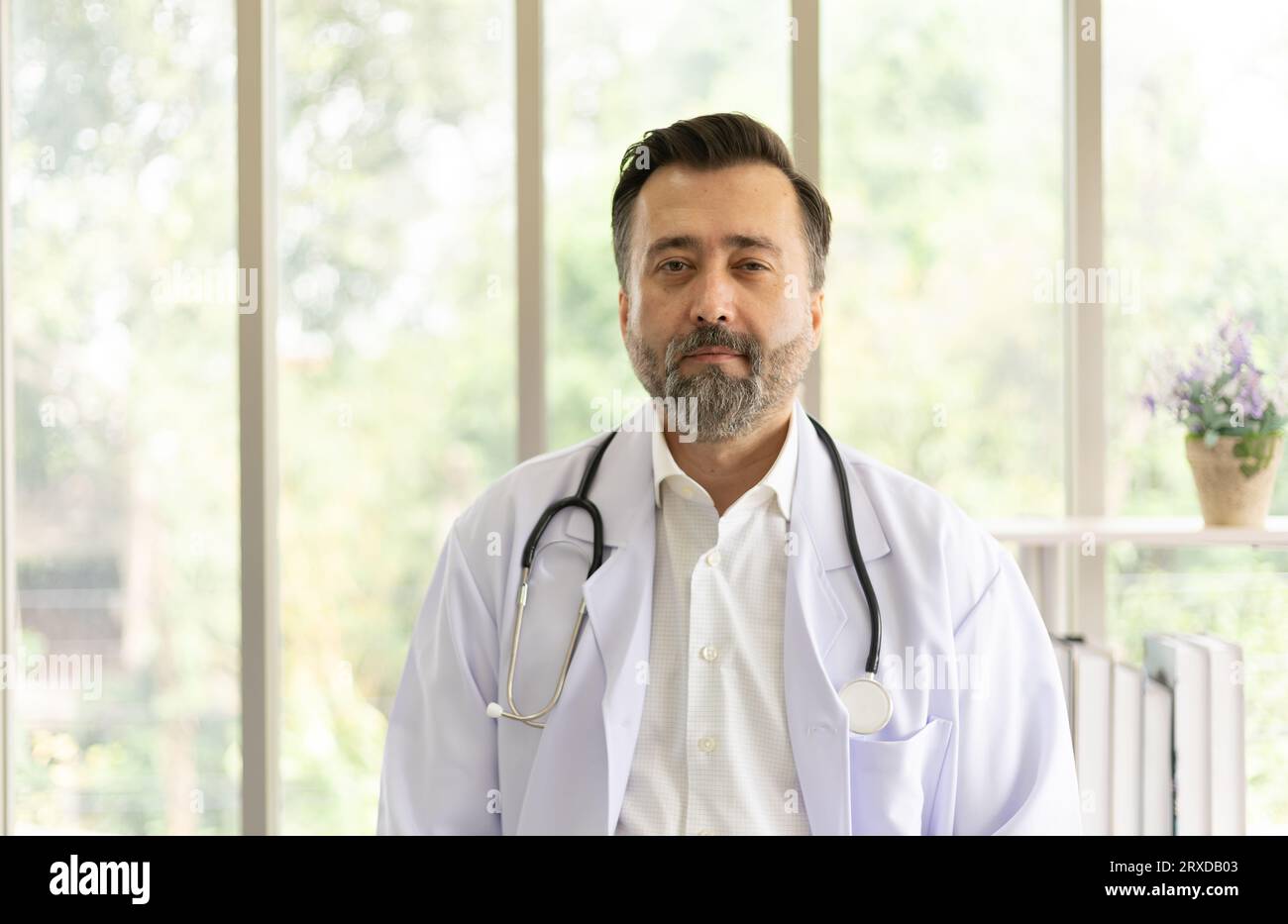 Caucasian physician portrait. Doctor with stethoscope portrait in ...