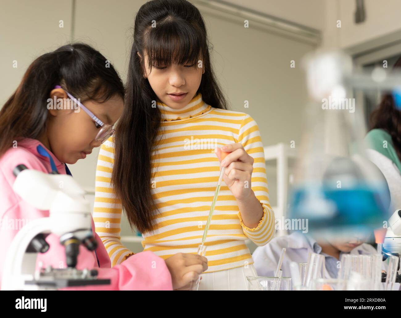 Children scientist doing science experiment test with chemistry in a ...
