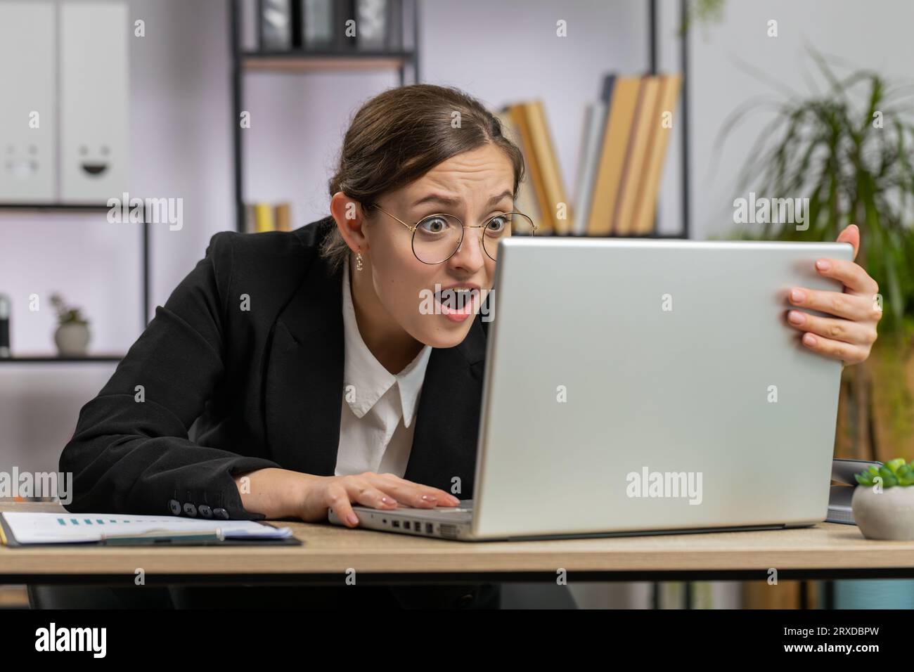 Angry business woman breaking laptop hi-res stock photography and ...