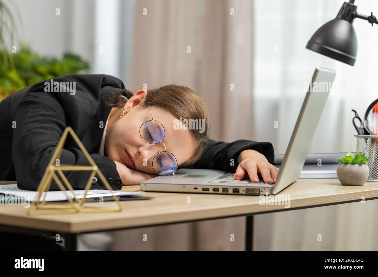 Bored sleepy Caucasian business woman worker working on laptop computer ...