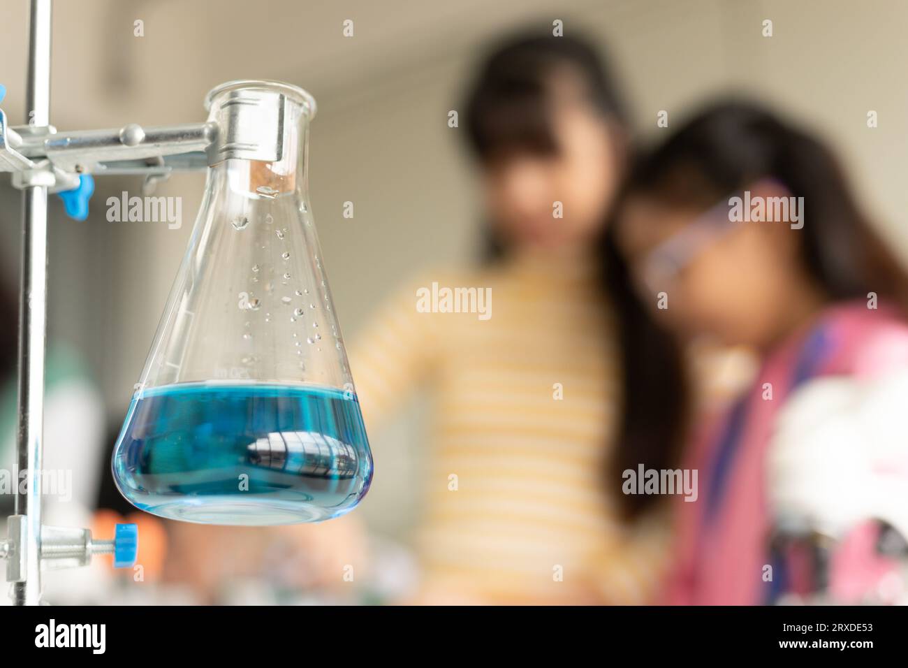 Children scientist doing science experiment test with chemistry in a ...