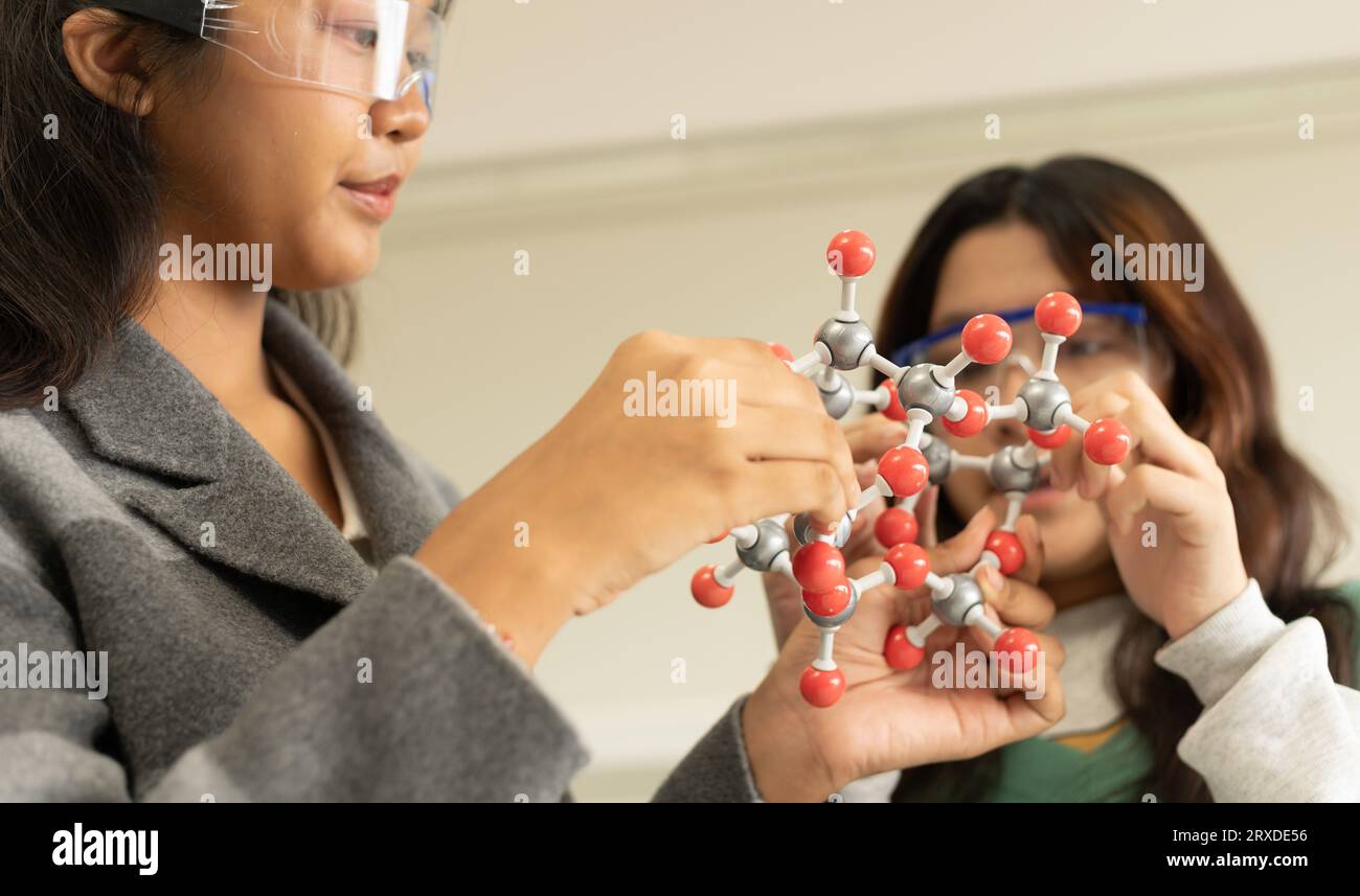 STEM education concept. Asian children in laboratory research an ...