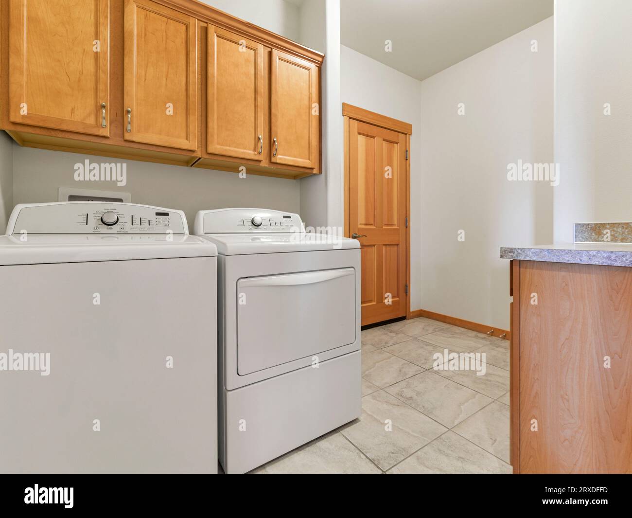 Modern residential laundry room interior Stock Photo - Alamy