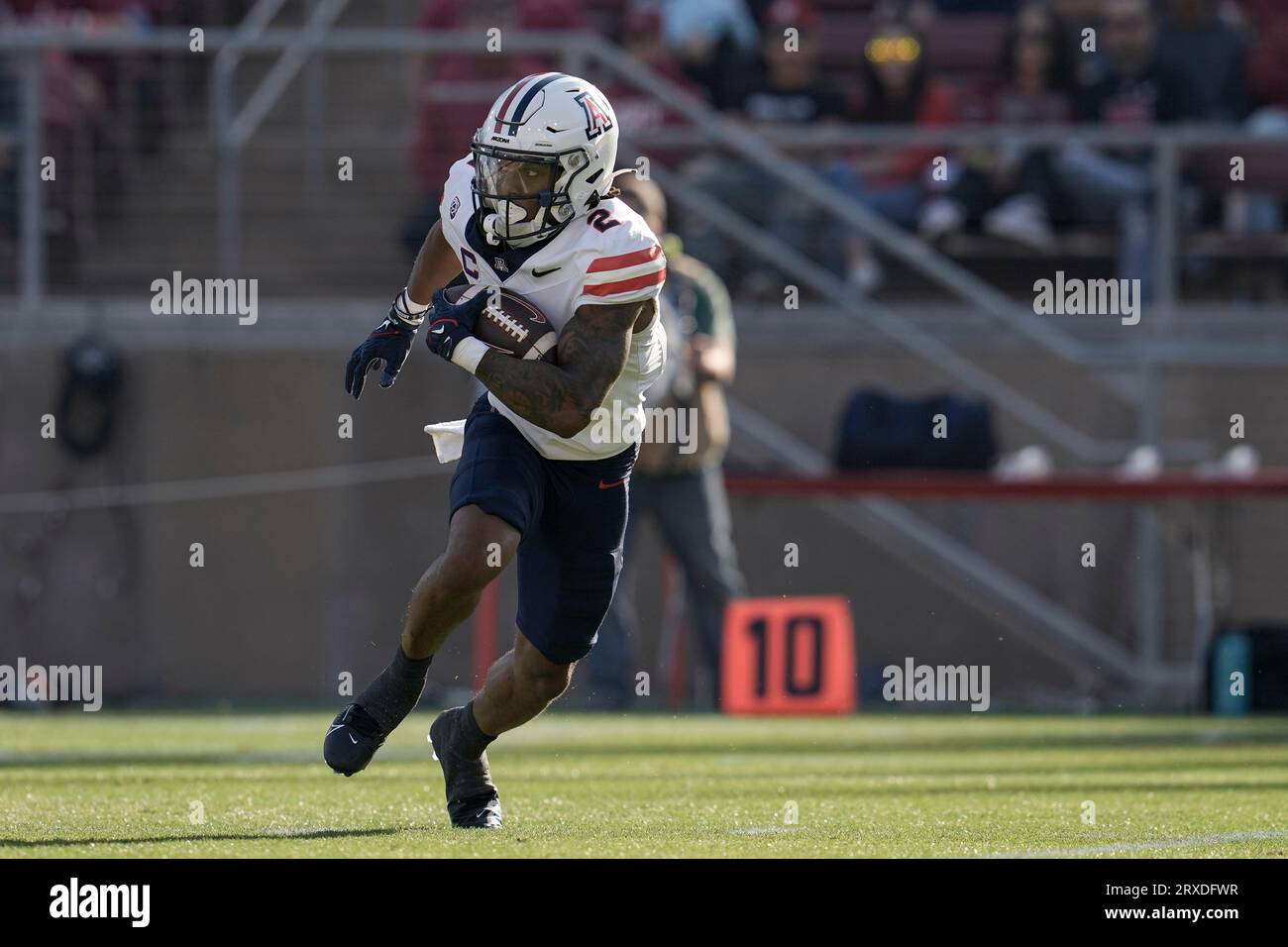 Arizona wide receiver Jacob Cowing returns a punt during the first half ...