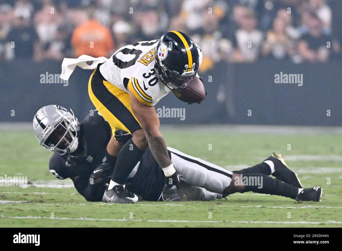 Pittsburgh Steelers running back Jaylen Warren (30) is tackled by Las ...