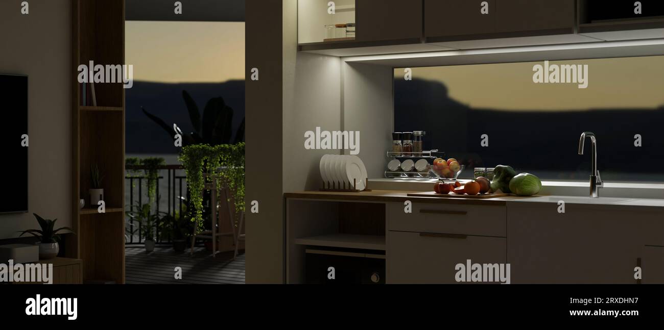 A modern and minimalist kitchen at night interior design with a sink ...