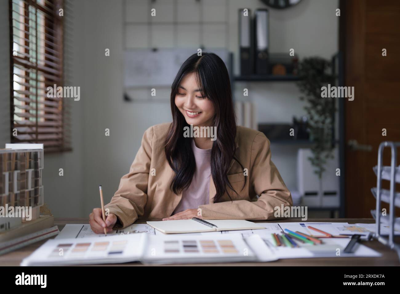 Female architect work to designing architecture interior and drawing ...