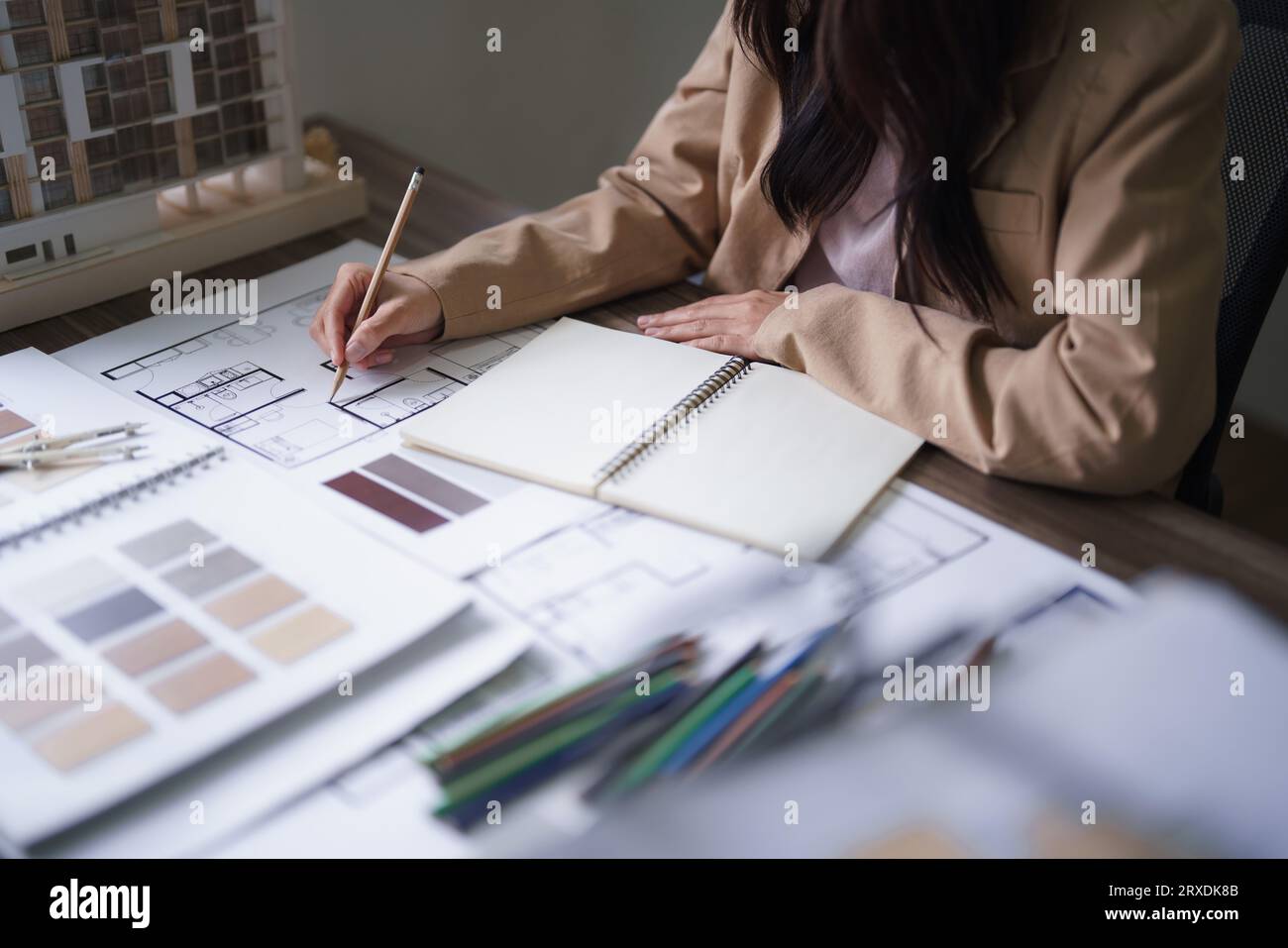 Female architect work to designing architecture interior and drawing ...