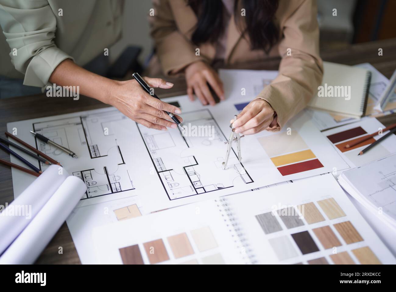 Two female architects discuss interior design building project and use ...