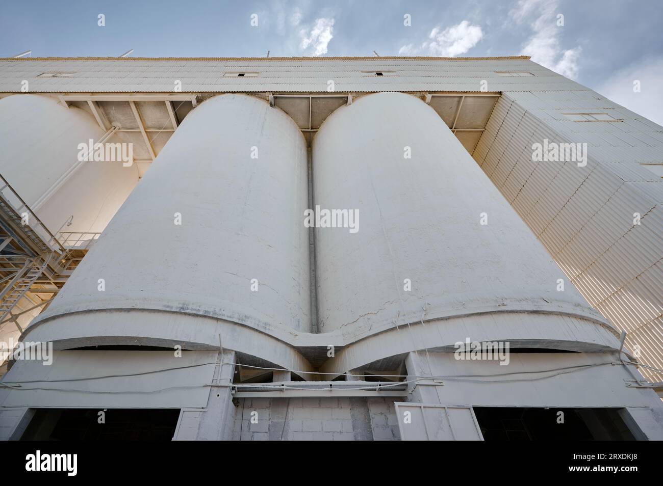 Large concrete silos for construction materials storage Stock Photo - Alamy