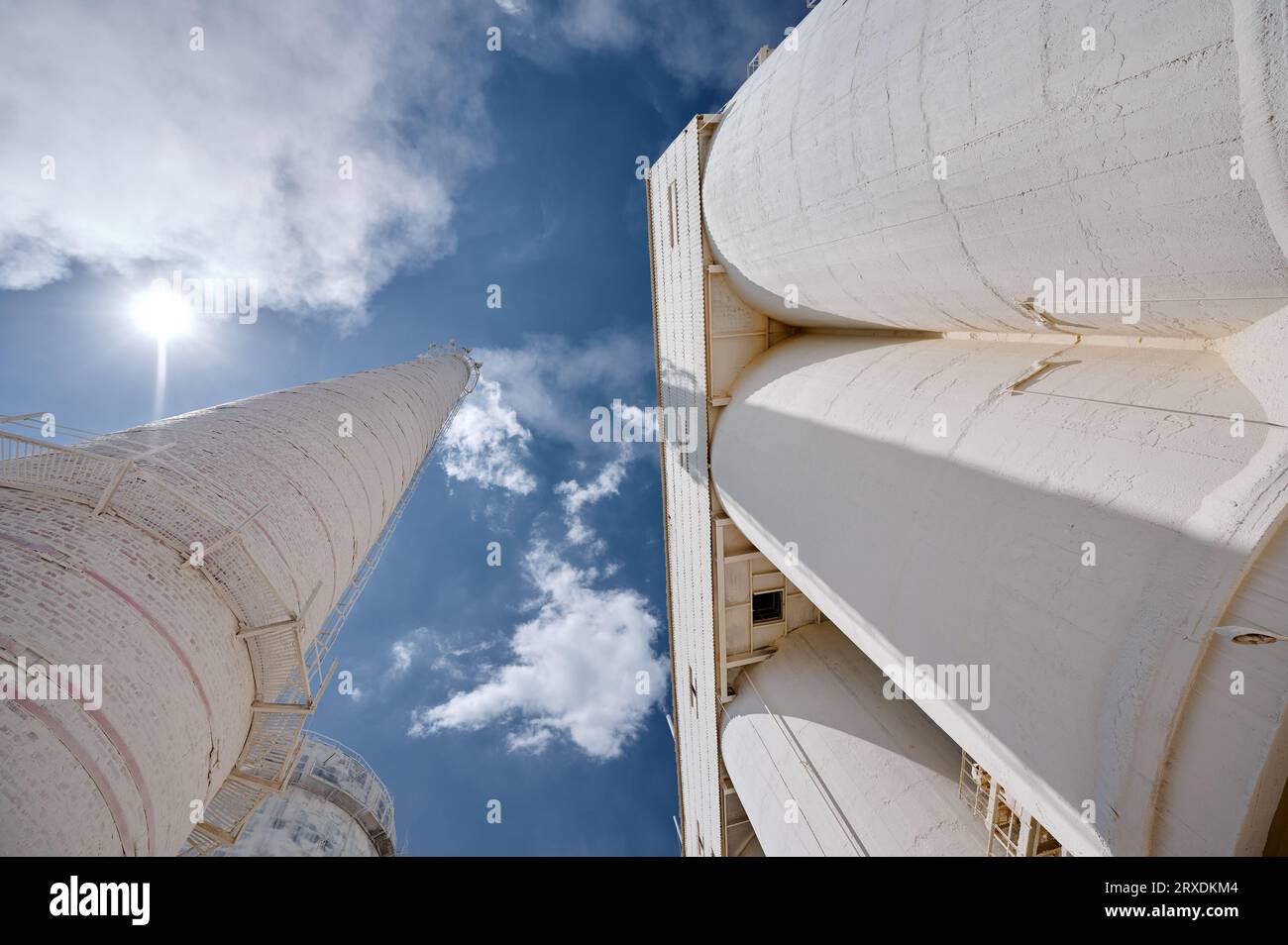 Brick chimney and concrete silos for limestone storage Stock Photo - Alamy