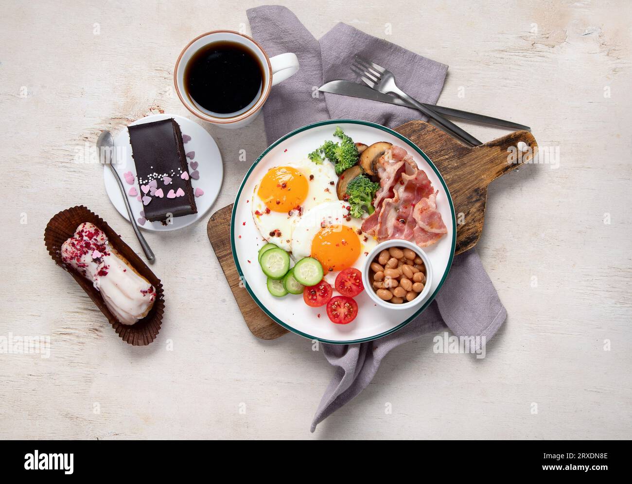 Traditional Englis breakfast plate with bacon strips, sunny side up ...