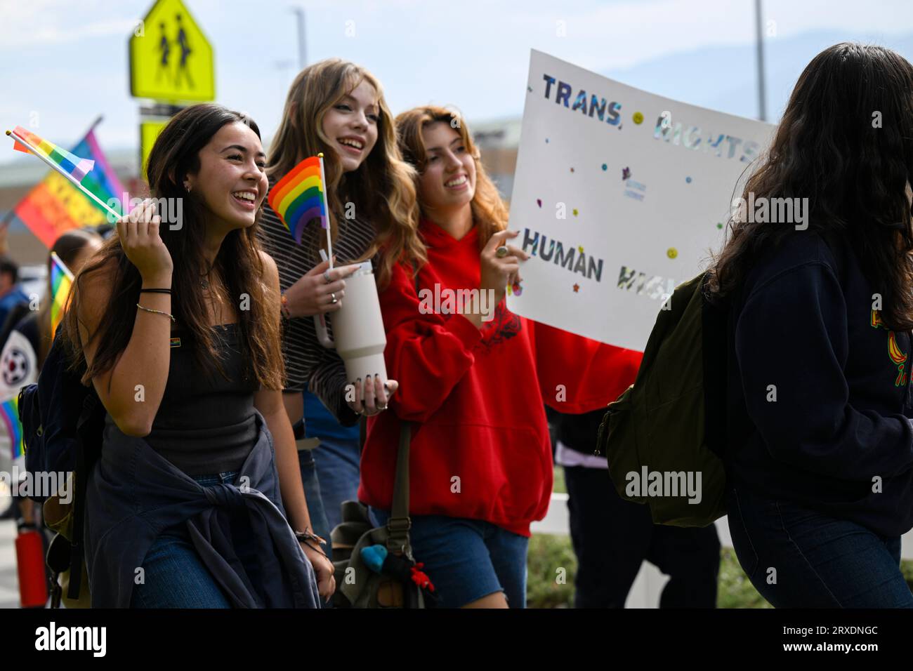 Students holding pride flags and trans flags gather at Pat Birdsall ...