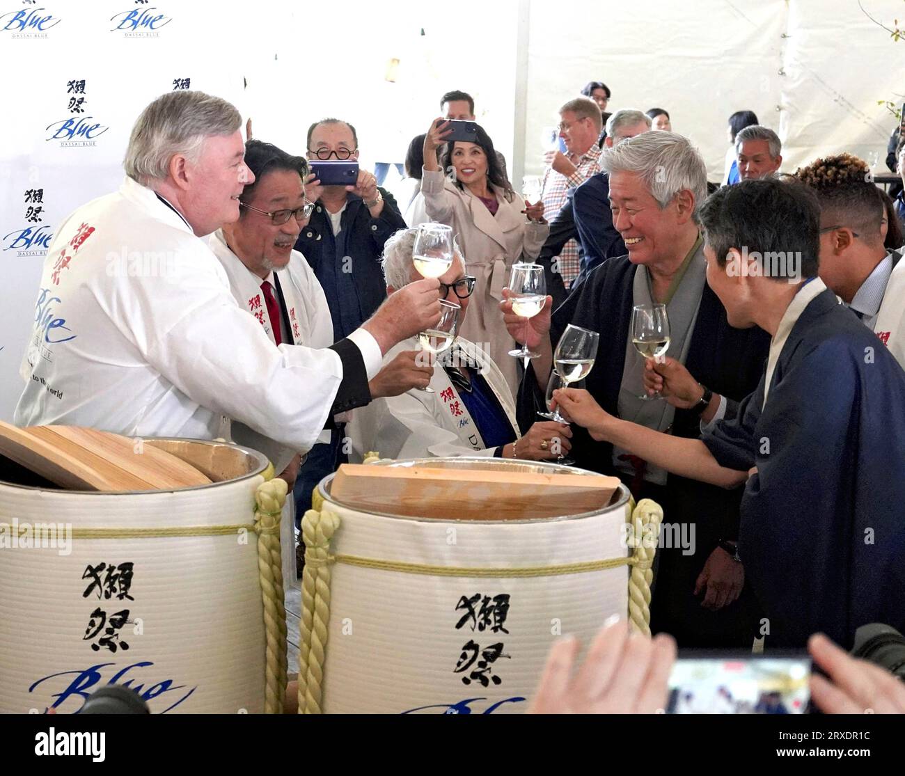 Hiroshi Sakurai (3rd from R), CEO of Asahi Shuzo, a Japanese sake ...