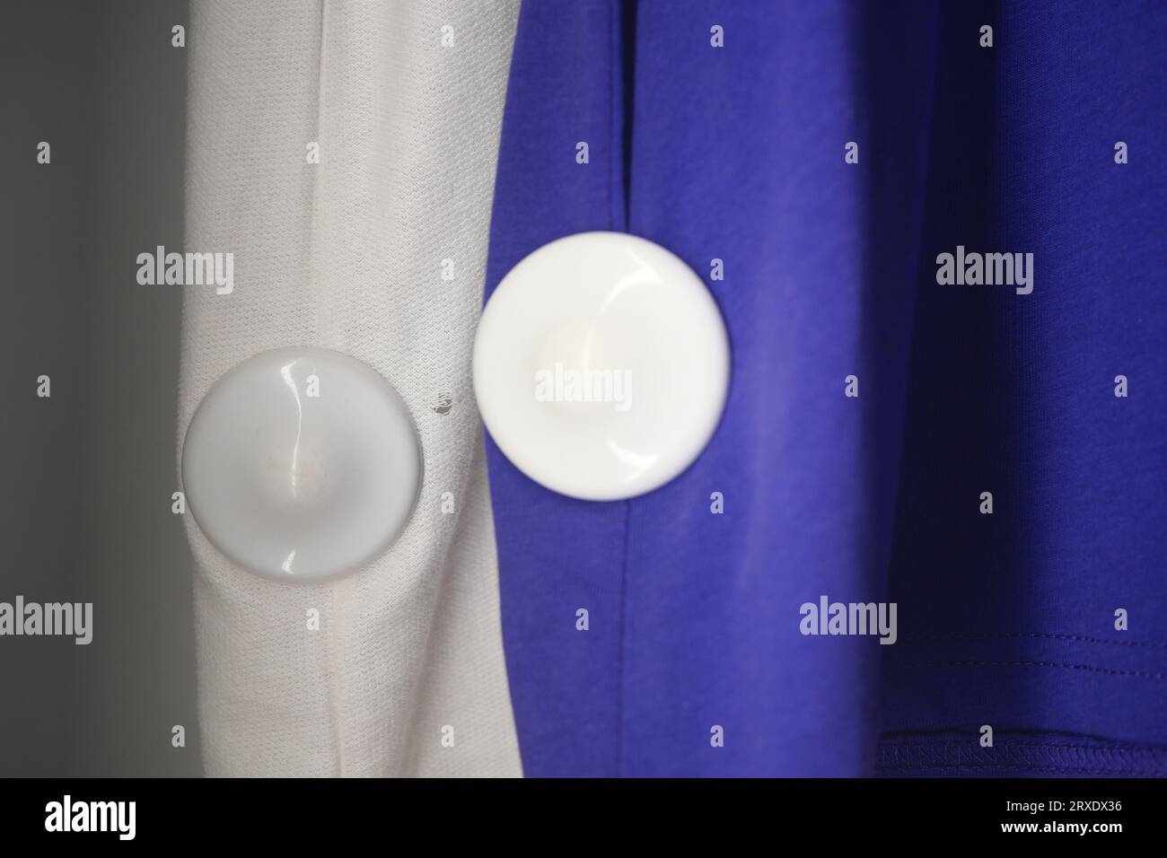 Security tags on clothes hi-res stock photography and images - Alamy