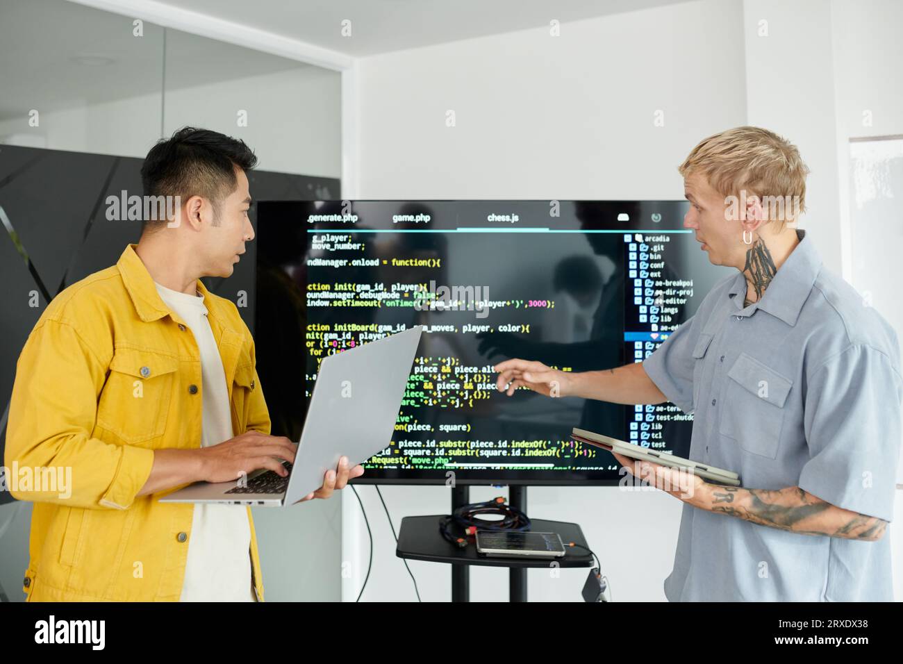 Developers arguing about programming code on computer screen Stock ...
