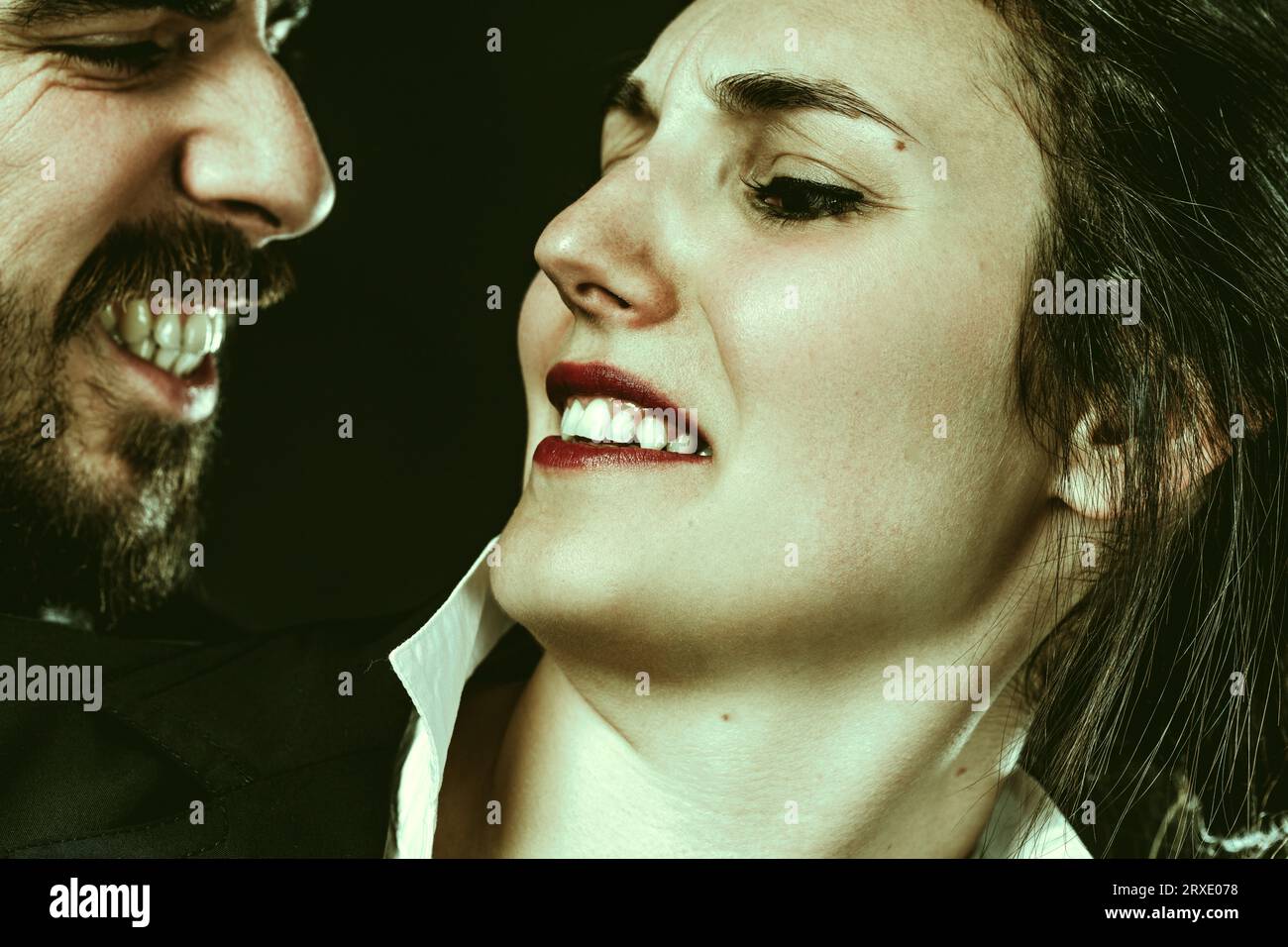 Dramatic depiction of a woman bothered or harassed by a man ...