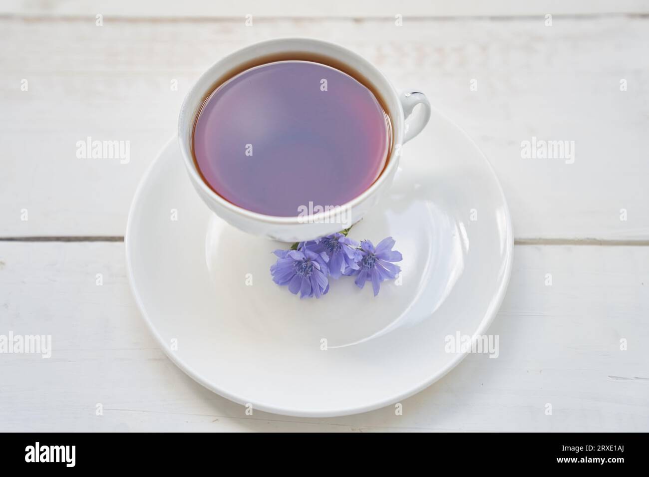 Delicious chicory drink, cups and saucers on a wooden table with a ...
