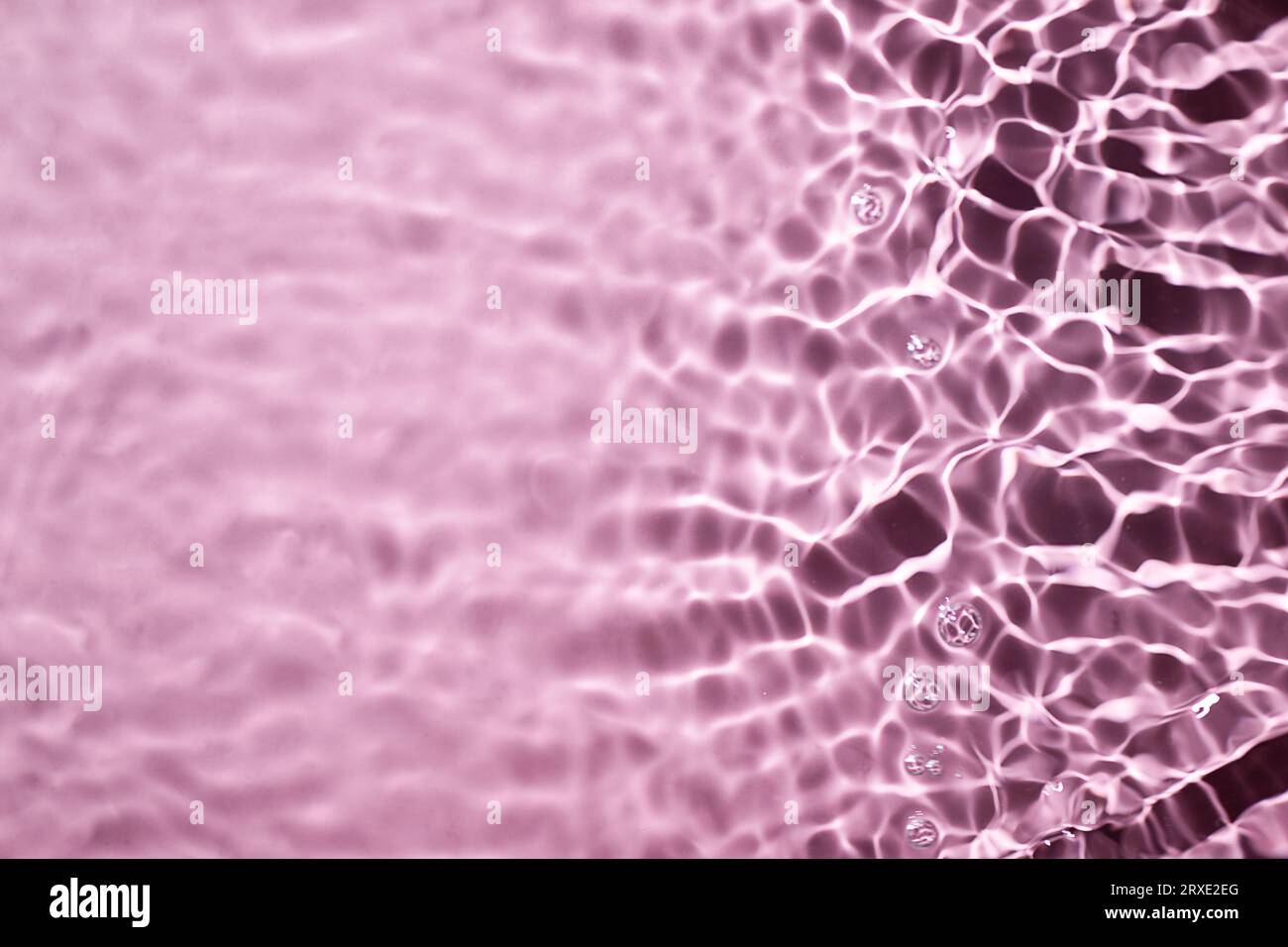 Pink water surface texture with splashes and bubbles. Abstract ...