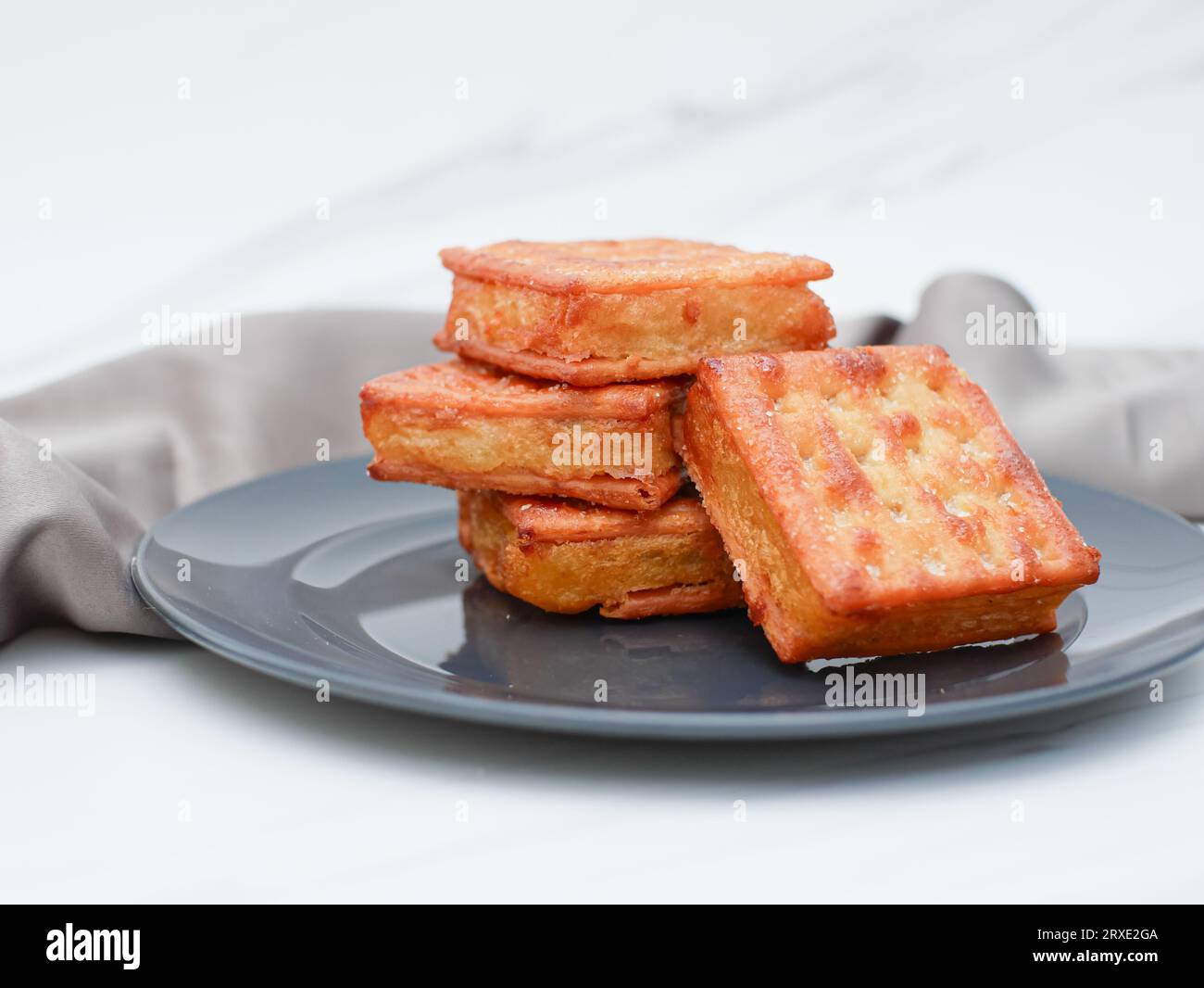 cracker biscuits filled with tapai, Indonesian biscuits Stock Photo - Alamy