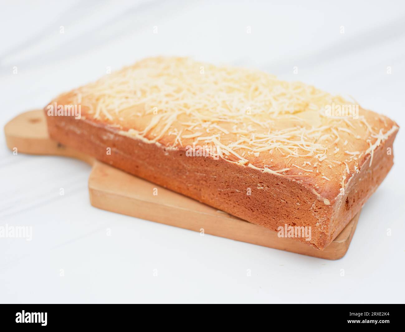 cassava tapai cake with cheese topping, indonesian food Stock Photo - Alamy