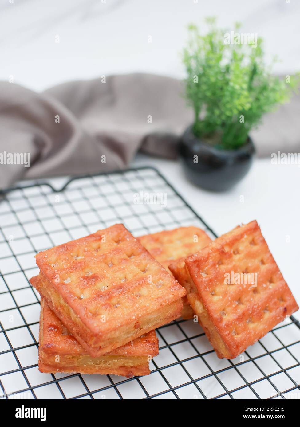cracker biscuits filled with tapai, Indonesian biscuits Stock Photo - Alamy