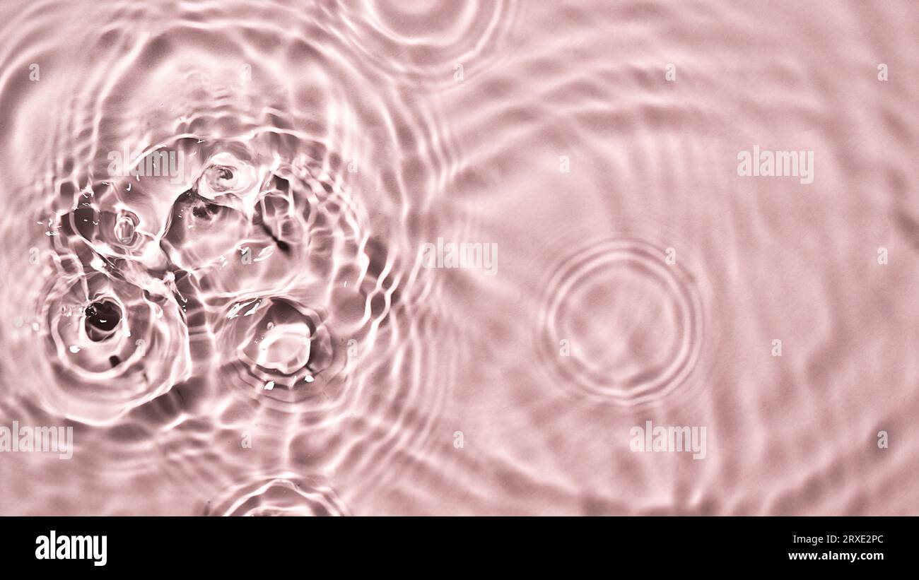 Pink water surface texture with splashes and bubbles. Abstract ...
