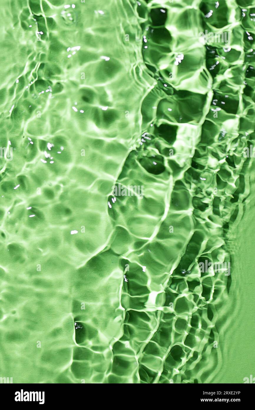 Light green water surface texture with splashes and bubbles. Abstract ...