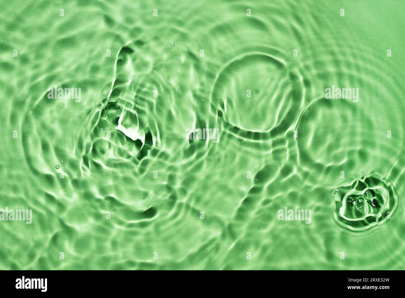 Light green water surface texture with splashes and bubbles. Abstract ...