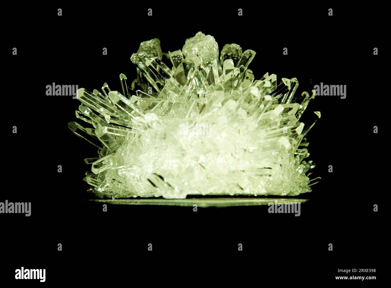 Shiny green sharp emerald crystal highlighted and isolated on black ...