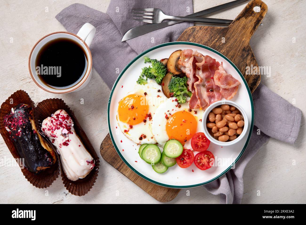 Traditional Englis breakfast plate with bacon strips, sunny side up ...