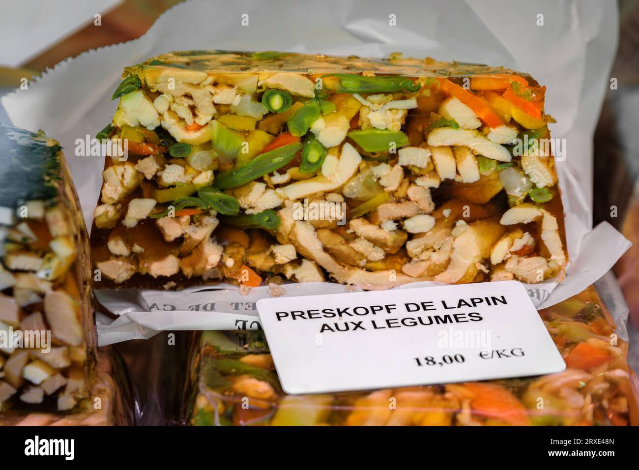 French butcher shop counter with head cheese for sale at a farmers ...