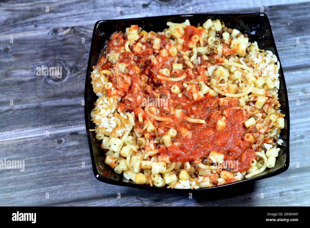 Egyptian cuisine of Koshary, a popular street food made of rice ...