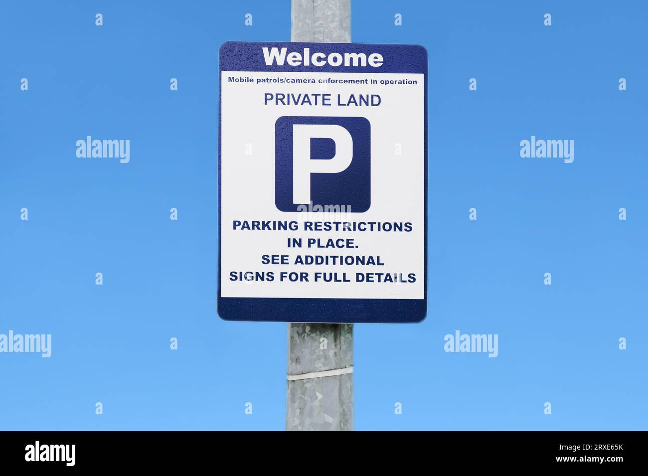 Private parking sign on land with parking restrictions Stock Photo - Alamy