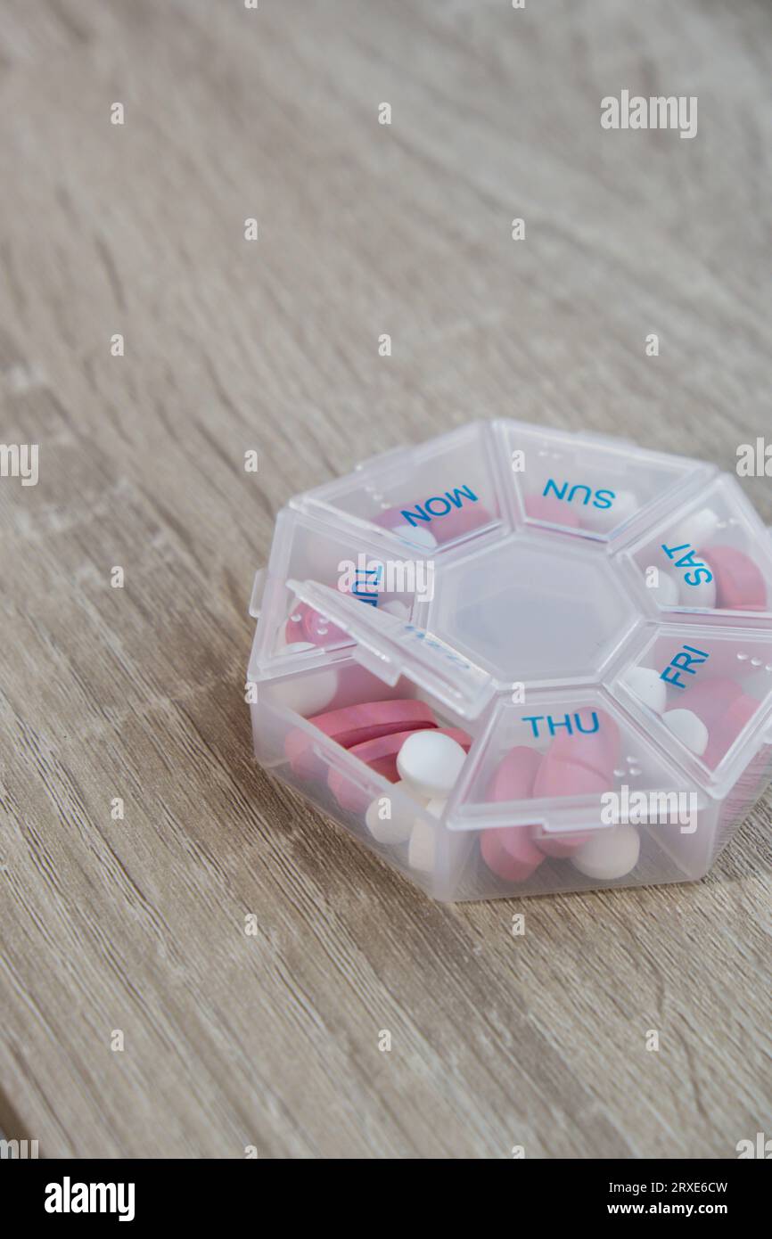 Organizer weekly shots Closeup of medical pill box with doses of ...