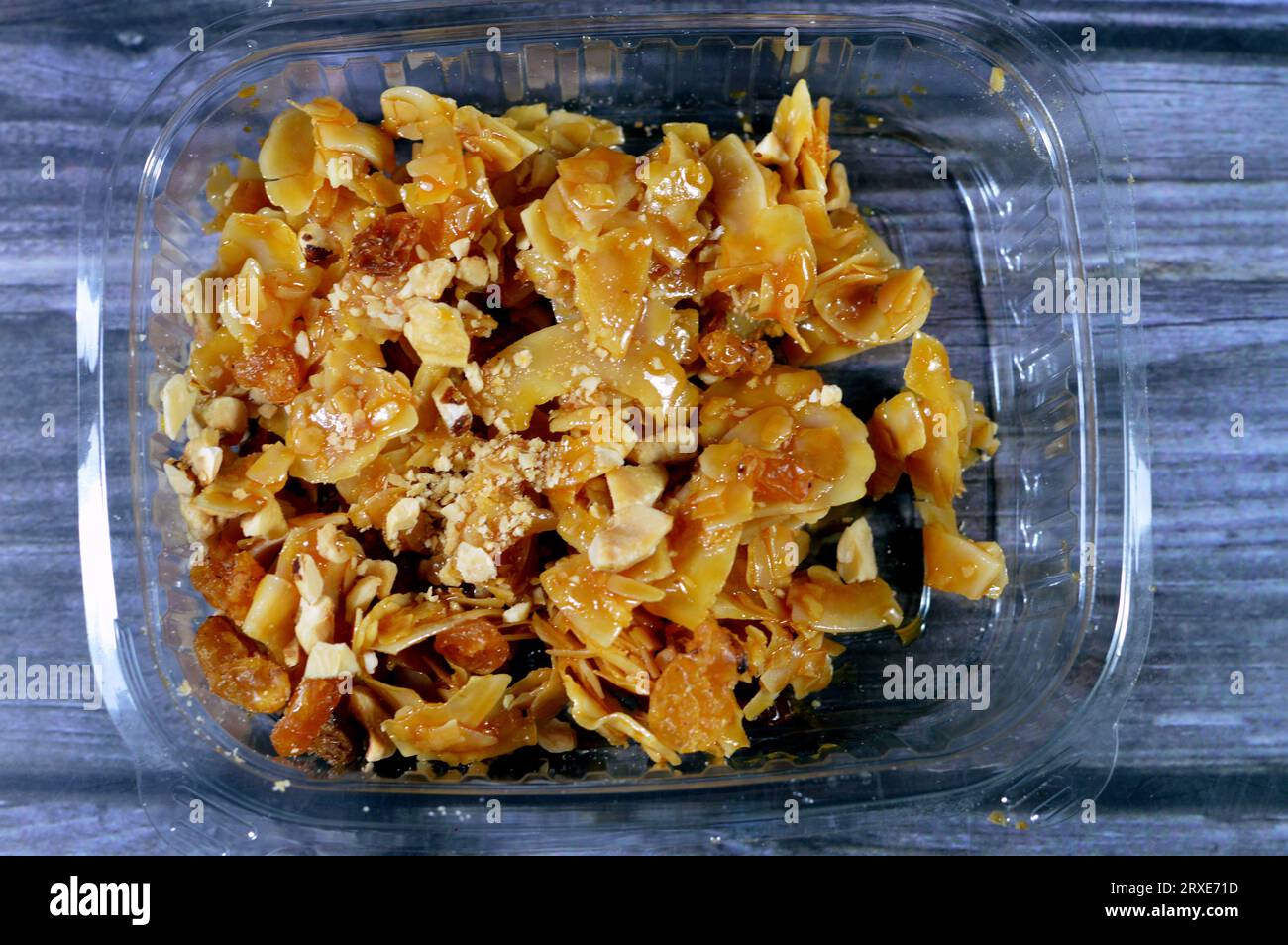 Ladida of Eastern candy made of pieces of shredded coconuts topped with ...