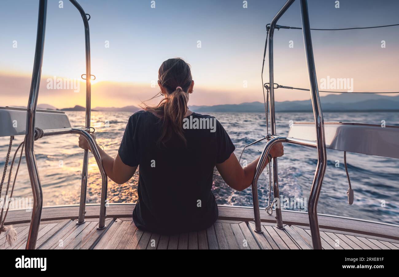 Nice female enjoying water cruise Stock Photo - Alamy