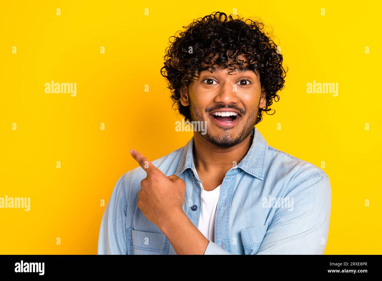 Portrait of astonished funky person indicate finger empty space ...