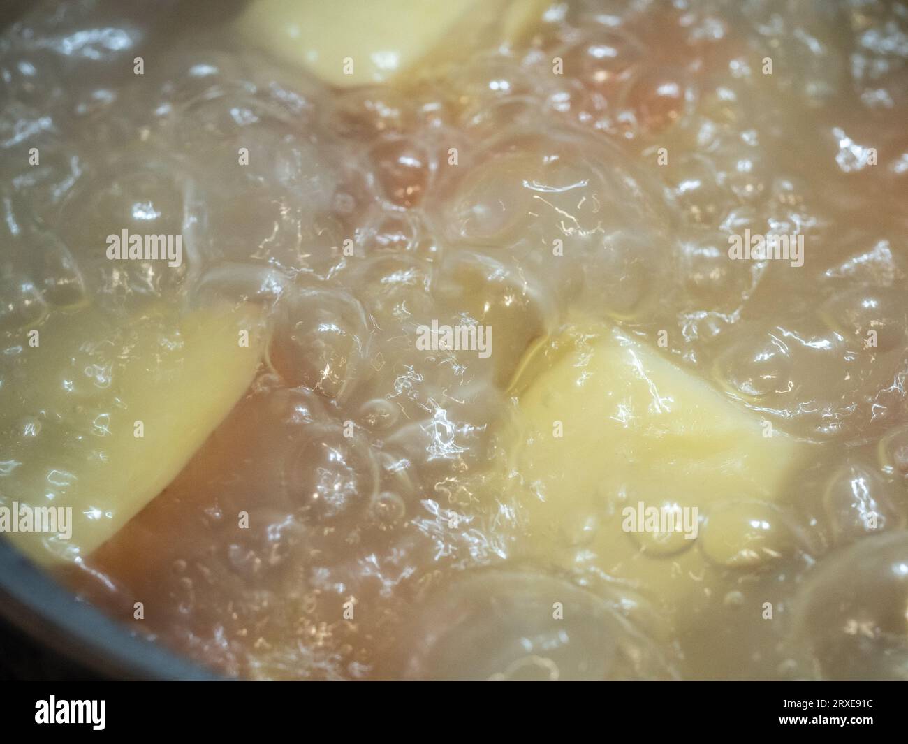 Potatoes in hot boiling water in a saucepan Stock Photo - Alamy