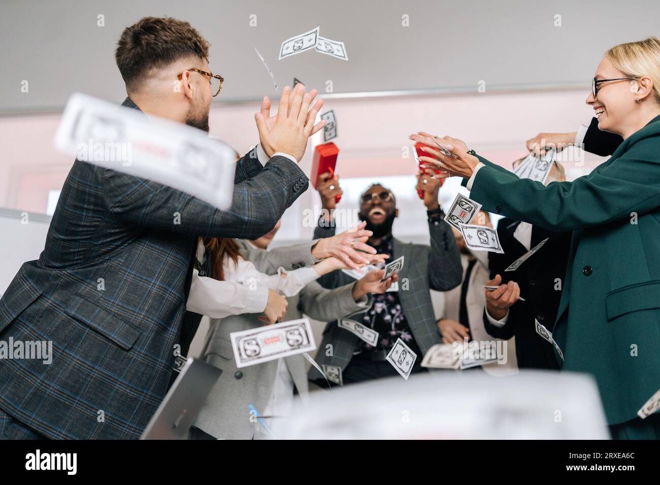 Happy excited African-American male boss in sunglasses and suit using ...