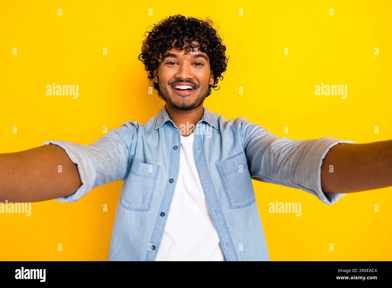 Portrait of cheerful nice young man beaming smile make selfie recording ...