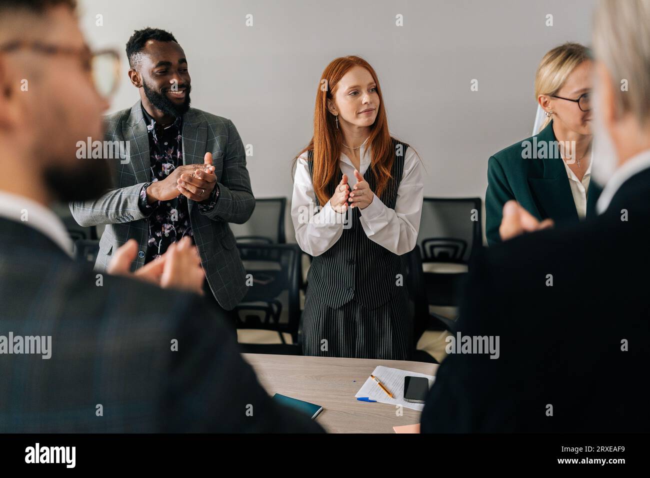 Group of happy business people, clapping or success in meeting for ...