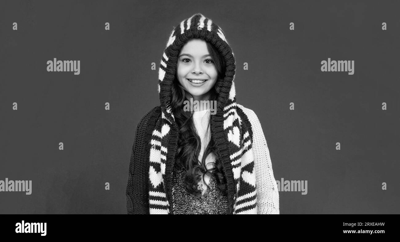 express positive emotion. winter fashion. happy kid with curly hair in ...