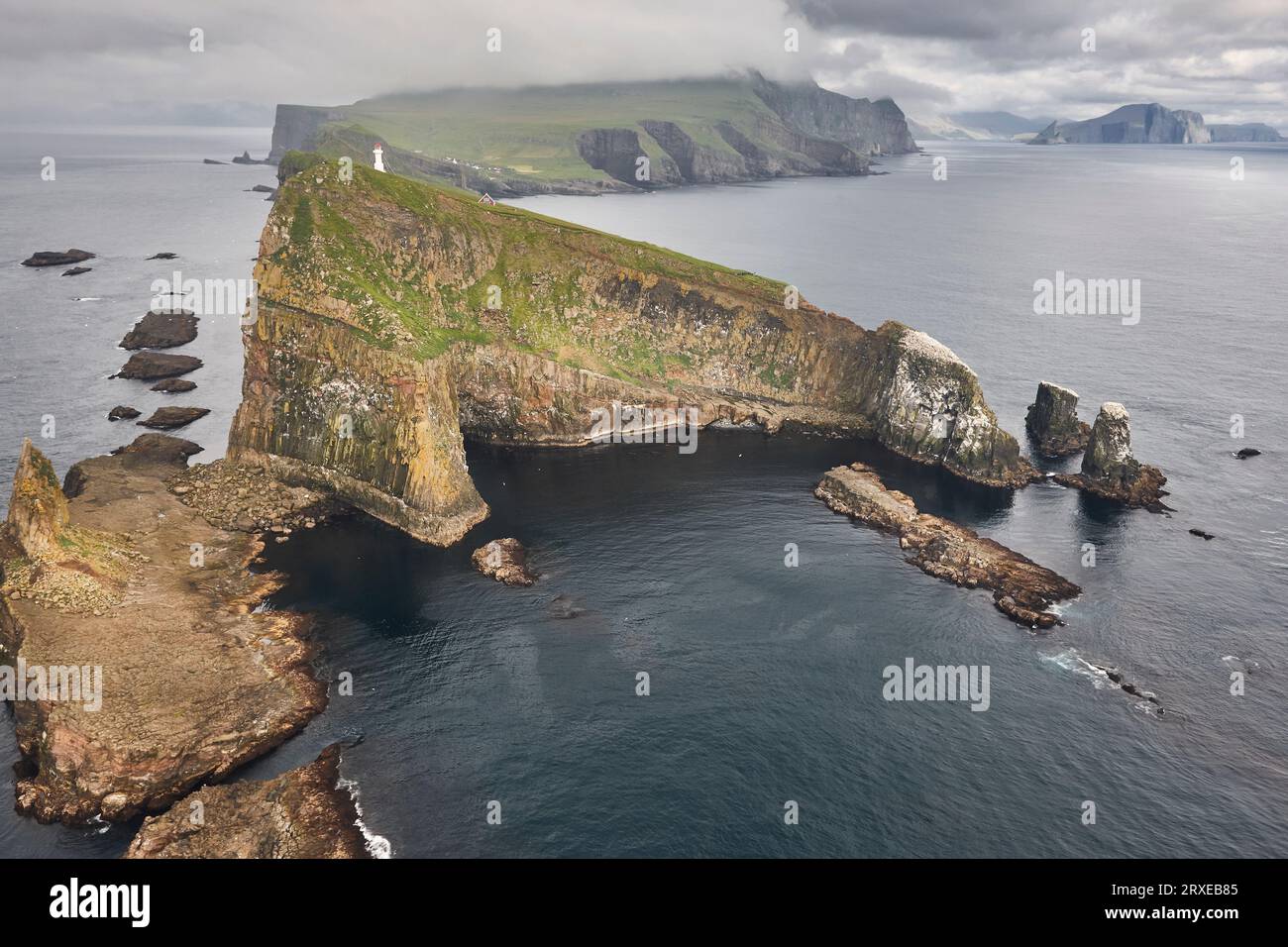 Mykines lighthouse and cliffs on Faroe islands from helicopter. Denmark ...