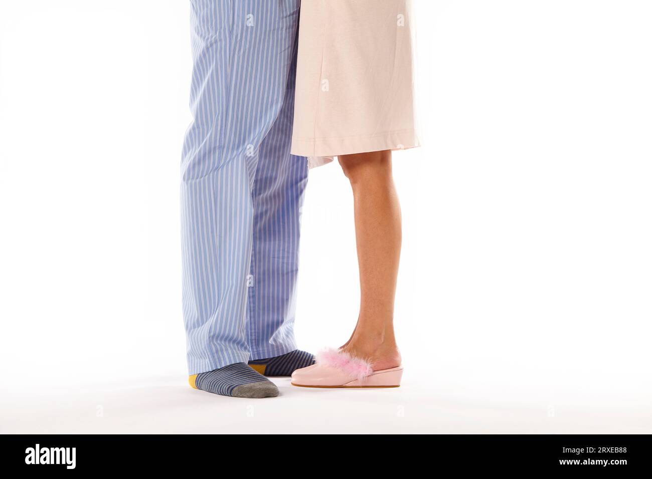 A couple in pajama. White background. Legs detail. Night wear Stock ...
